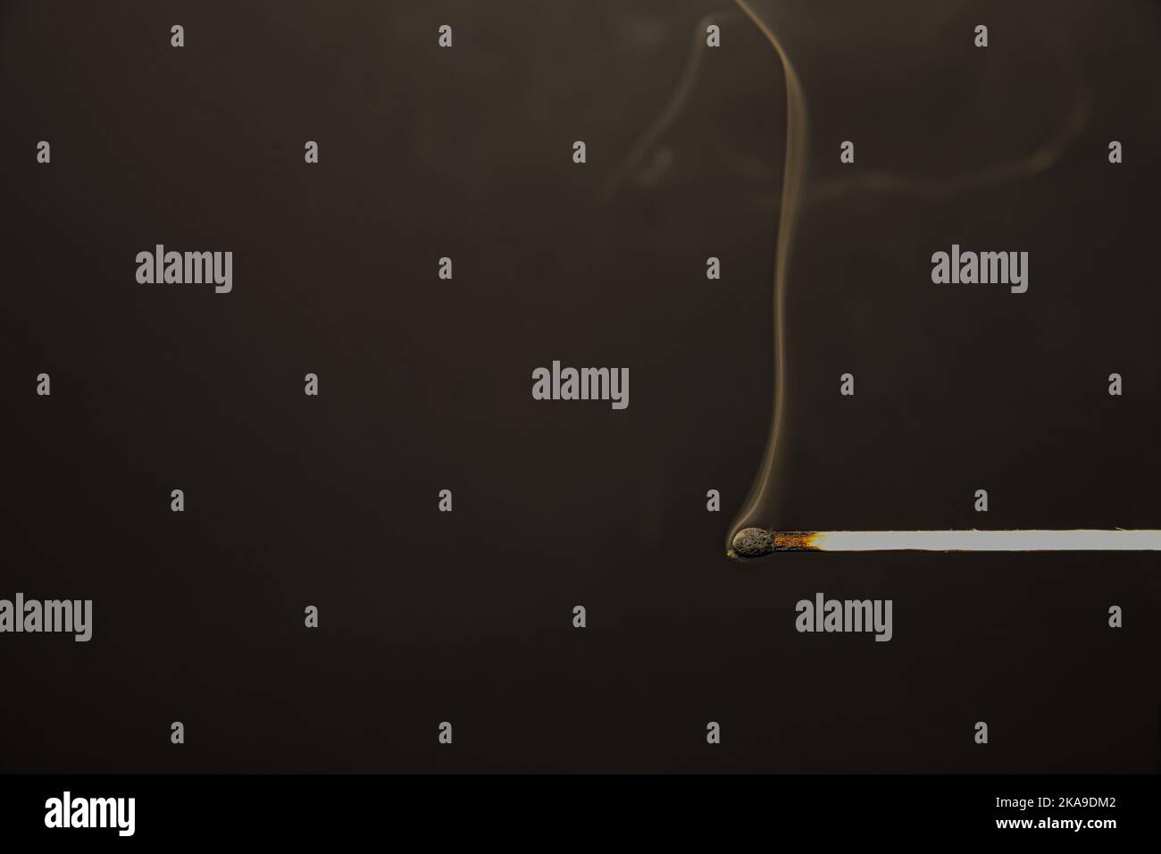 Image of a burned out matchstick with smoke Stock Photo - Alamy