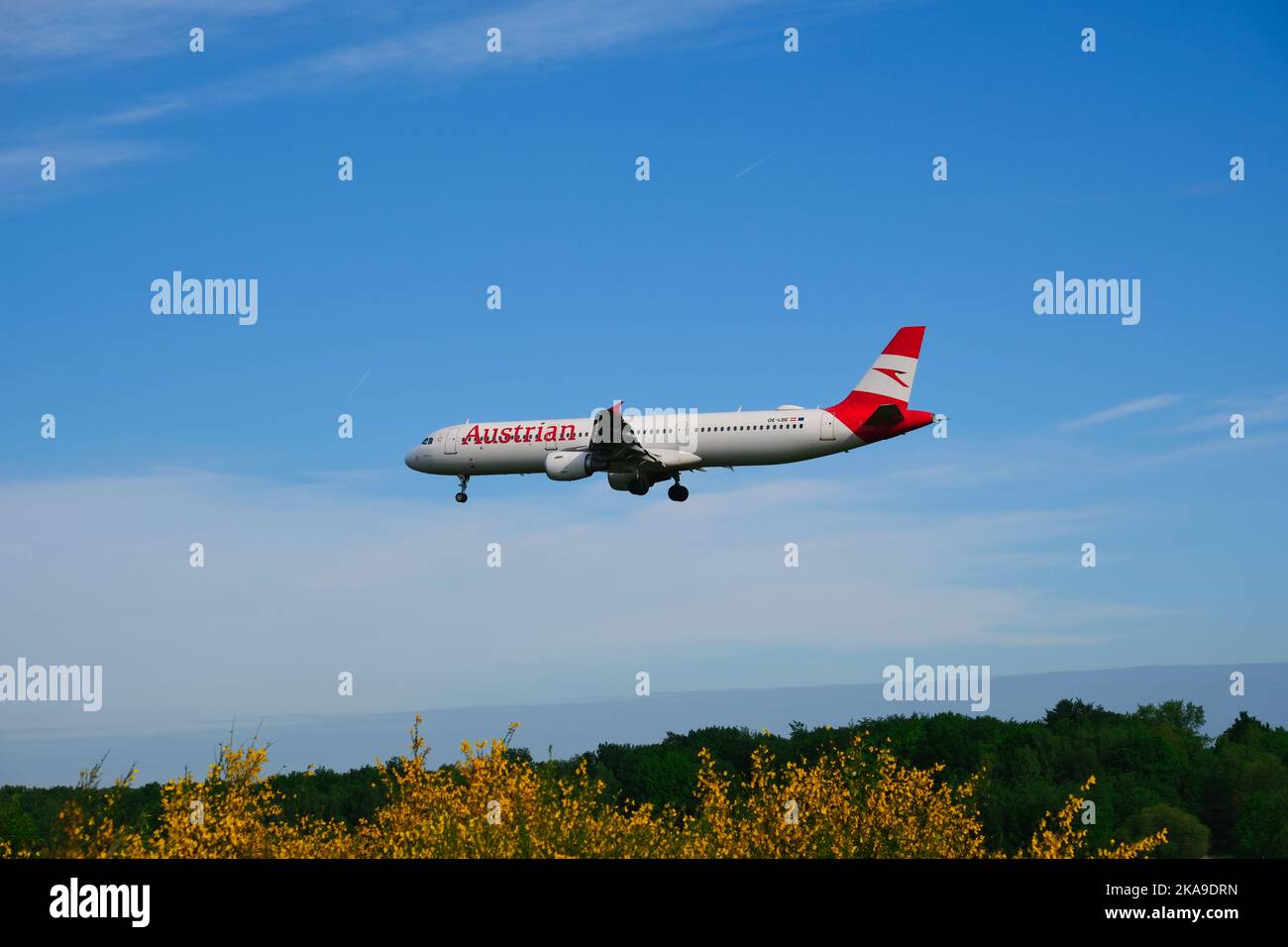 austrian plane landing at cologne bonn airport, blue sky Stock Photo ...
