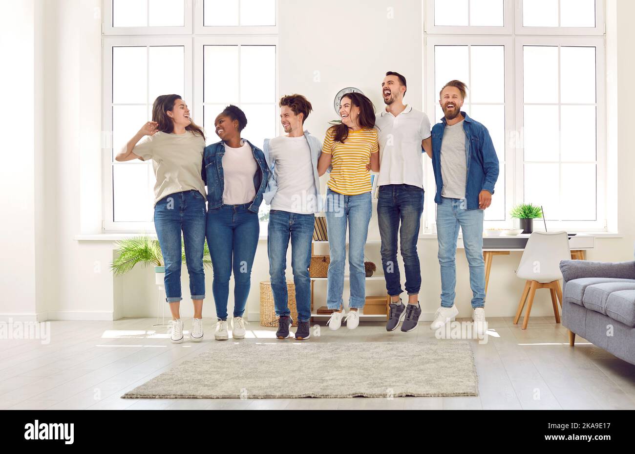 Group of happy, cheerful multiracial friends having fun at a small ...