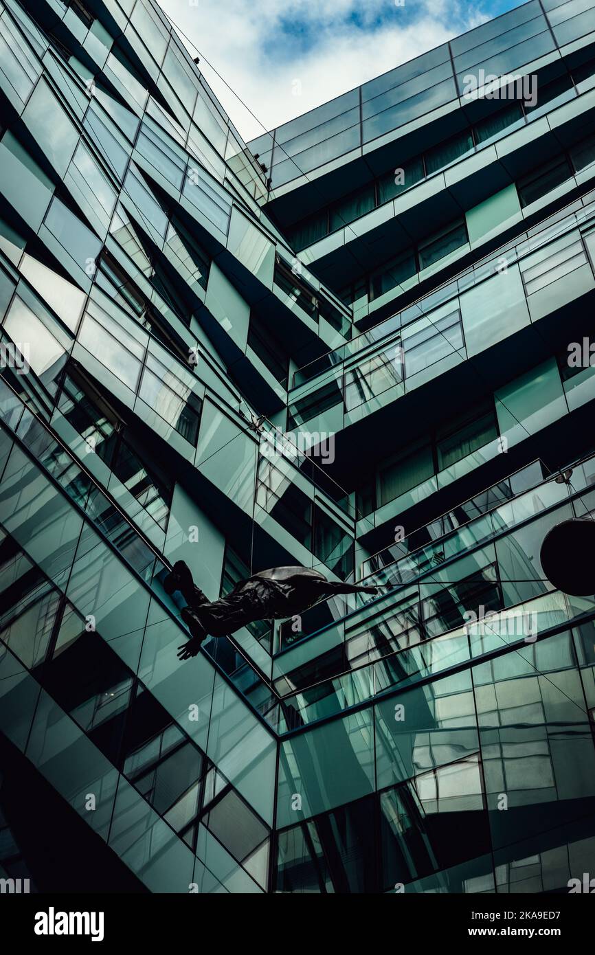 The vertical shot of a modern building facade exterior with glass ...