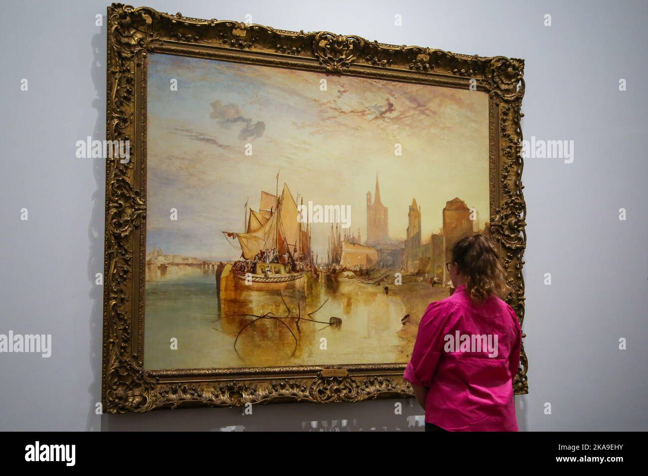 A National gallery staff member views British artist Joseph Mallord ...