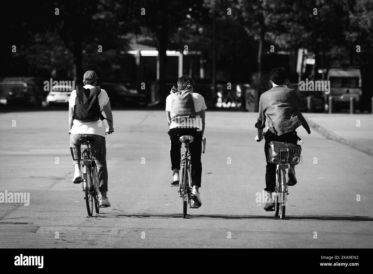 Three people riding on Black and White Stock Photos & Images - Alamy