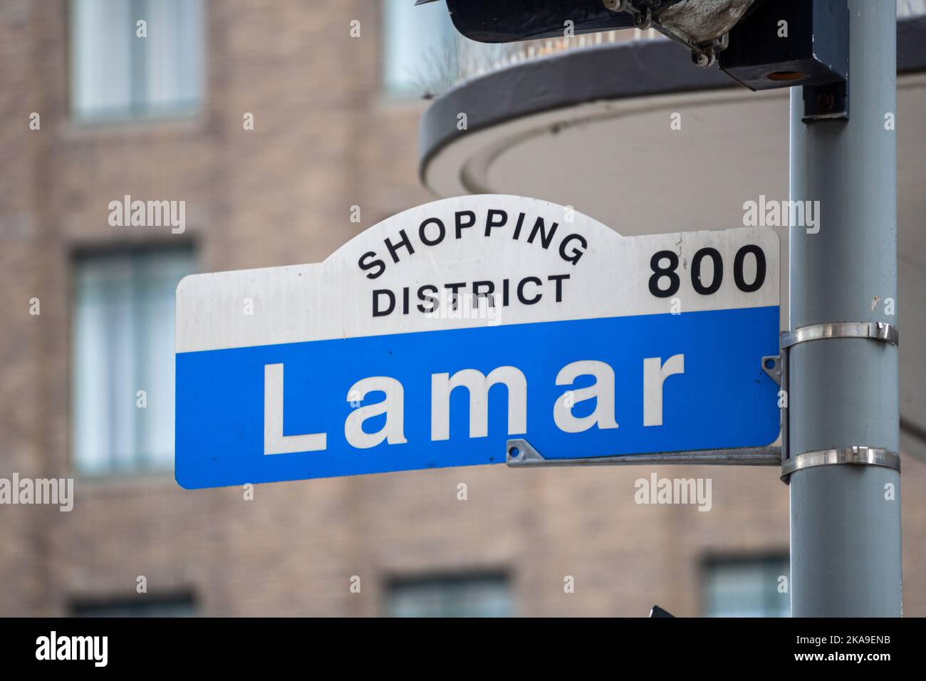 A "Lamar" street sign in Downtown Houston, Texas in a blurred ...