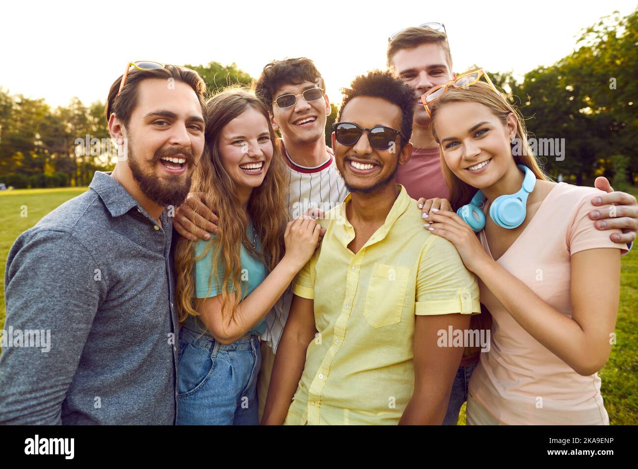 Group portrait of happy cheerful young diverse friends together in the ...