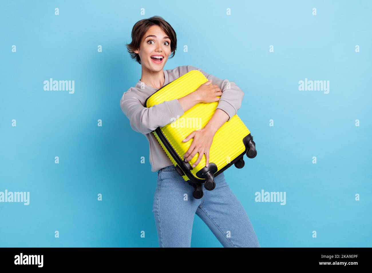 Photo of short hairdo young lady hold bag wear shirt jeans isolated on ...