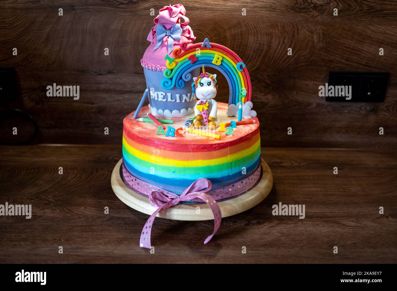 A closeup shot of a colorful rainbow unicorn back-to-school cake Stock ...