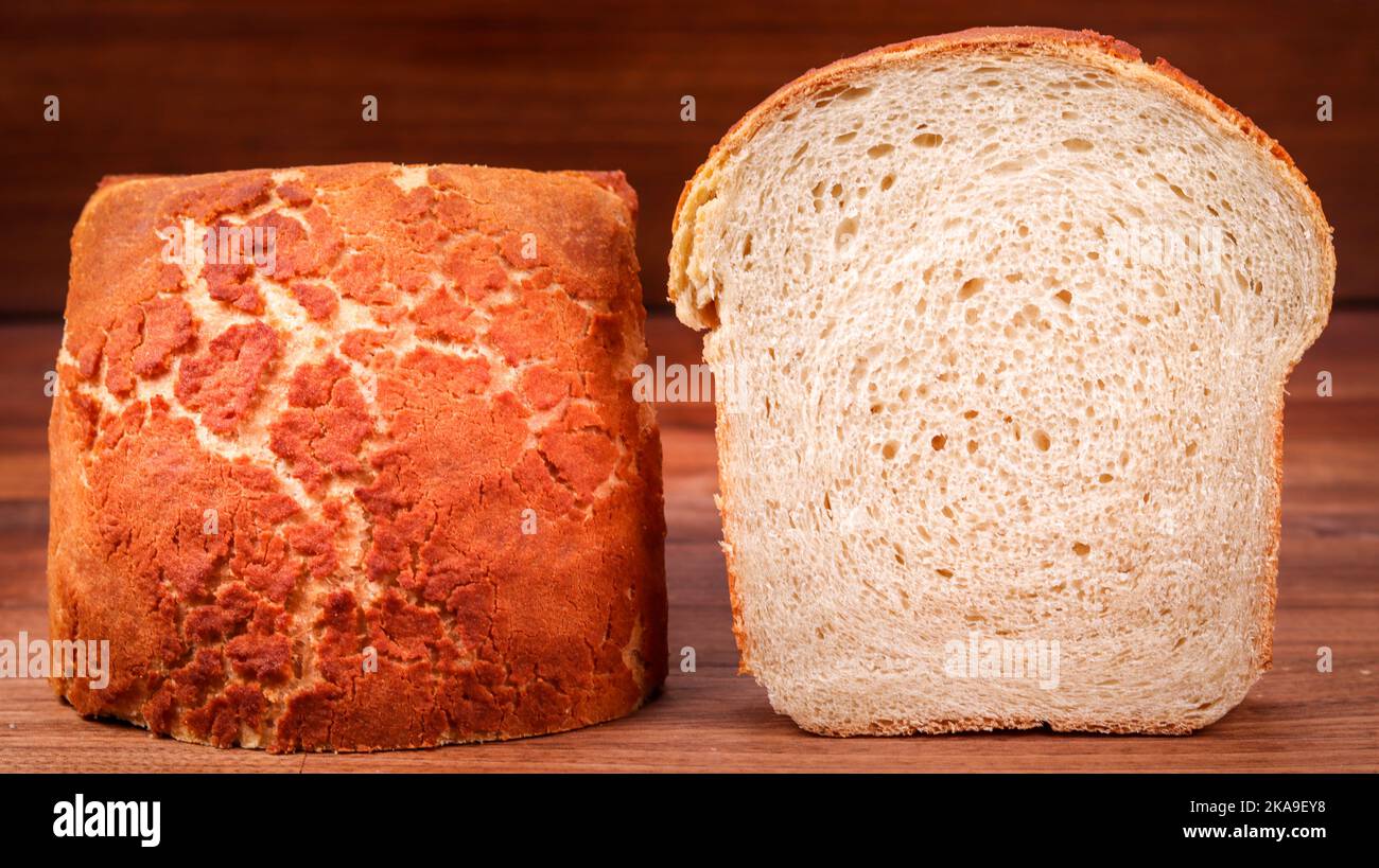 A closeup of a fresh loaf of bread on the wooden surface Stock Photo ...