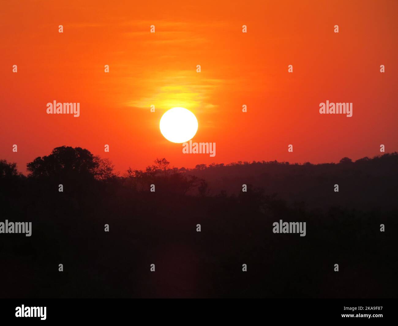 A beautiful view of a red sunset in a cloudless sky Stock Photo - Alamy