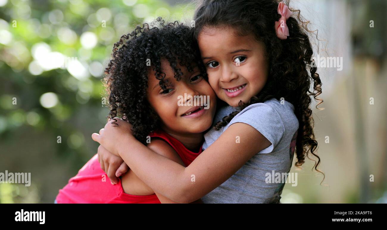 Hispanic siblings embrace and hug. Two sisters love Stock Photo - Alamy