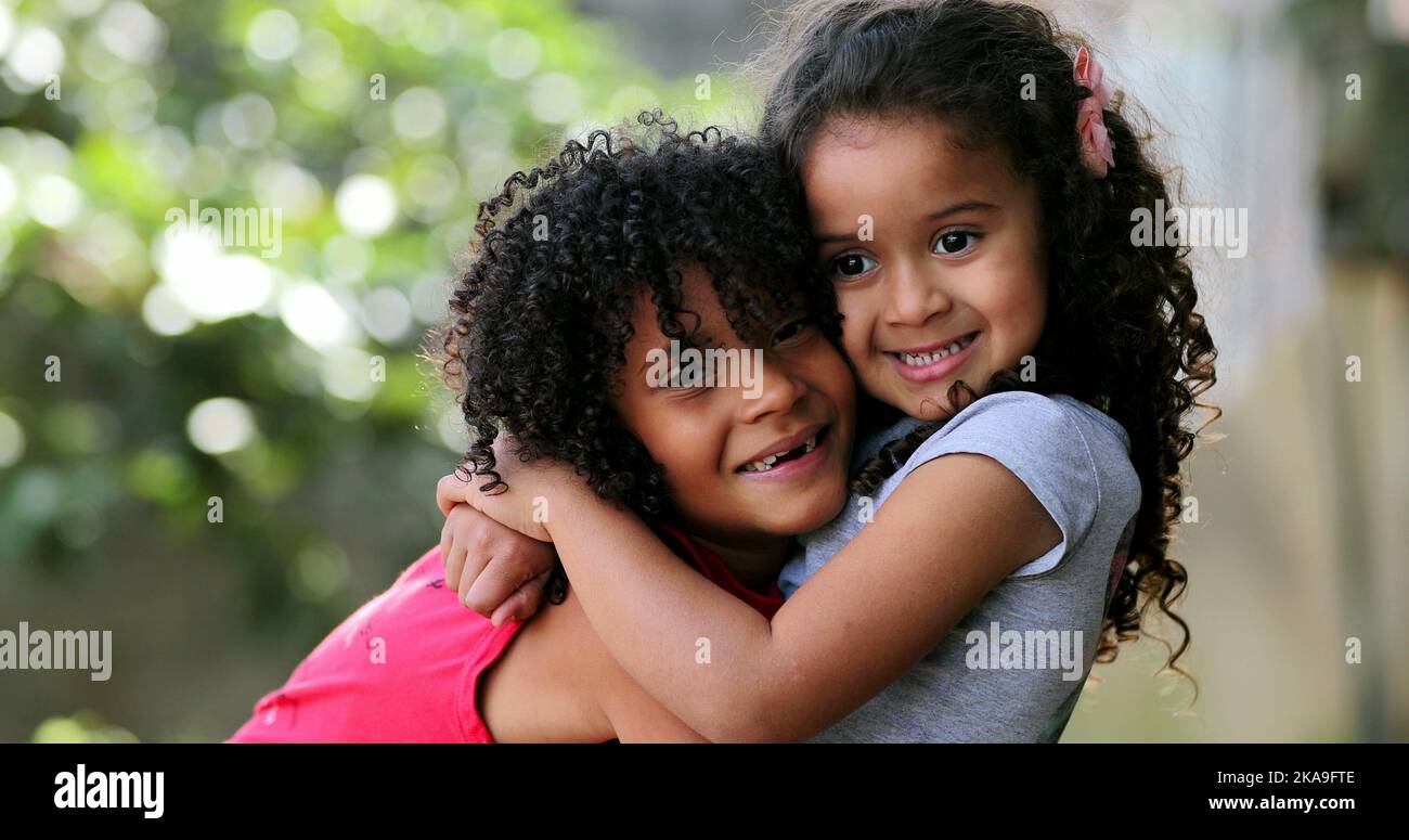 Hispanic siblings embrace and hug. Two sisters love Stock Photo - Alamy