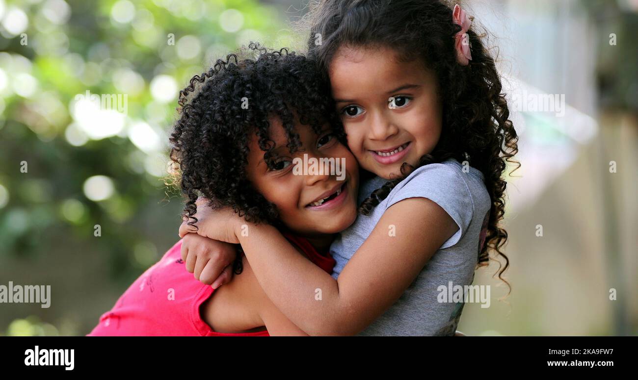 Hispanic siblings embrace and hug. Two sisters love Stock Photo - Alamy