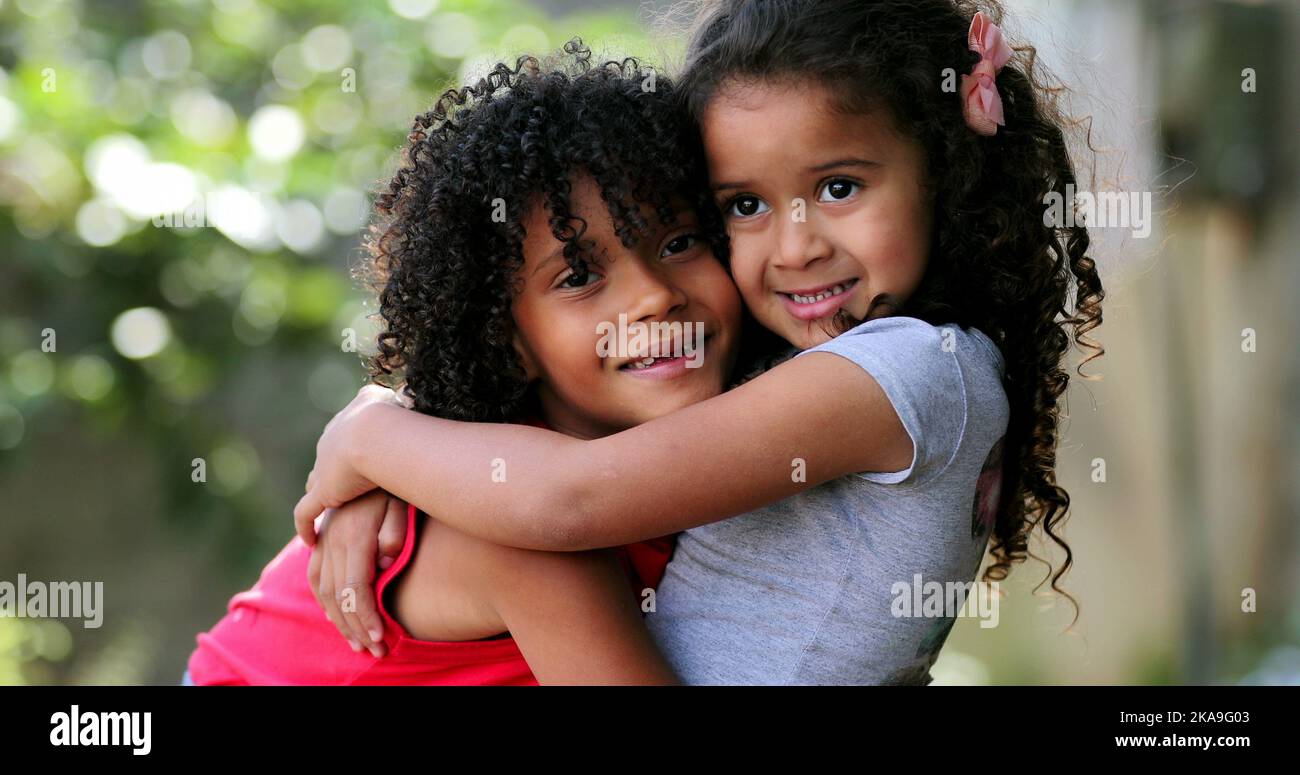 Hispanic siblings embrace and hug. Two sisters love Stock Photo - Alamy