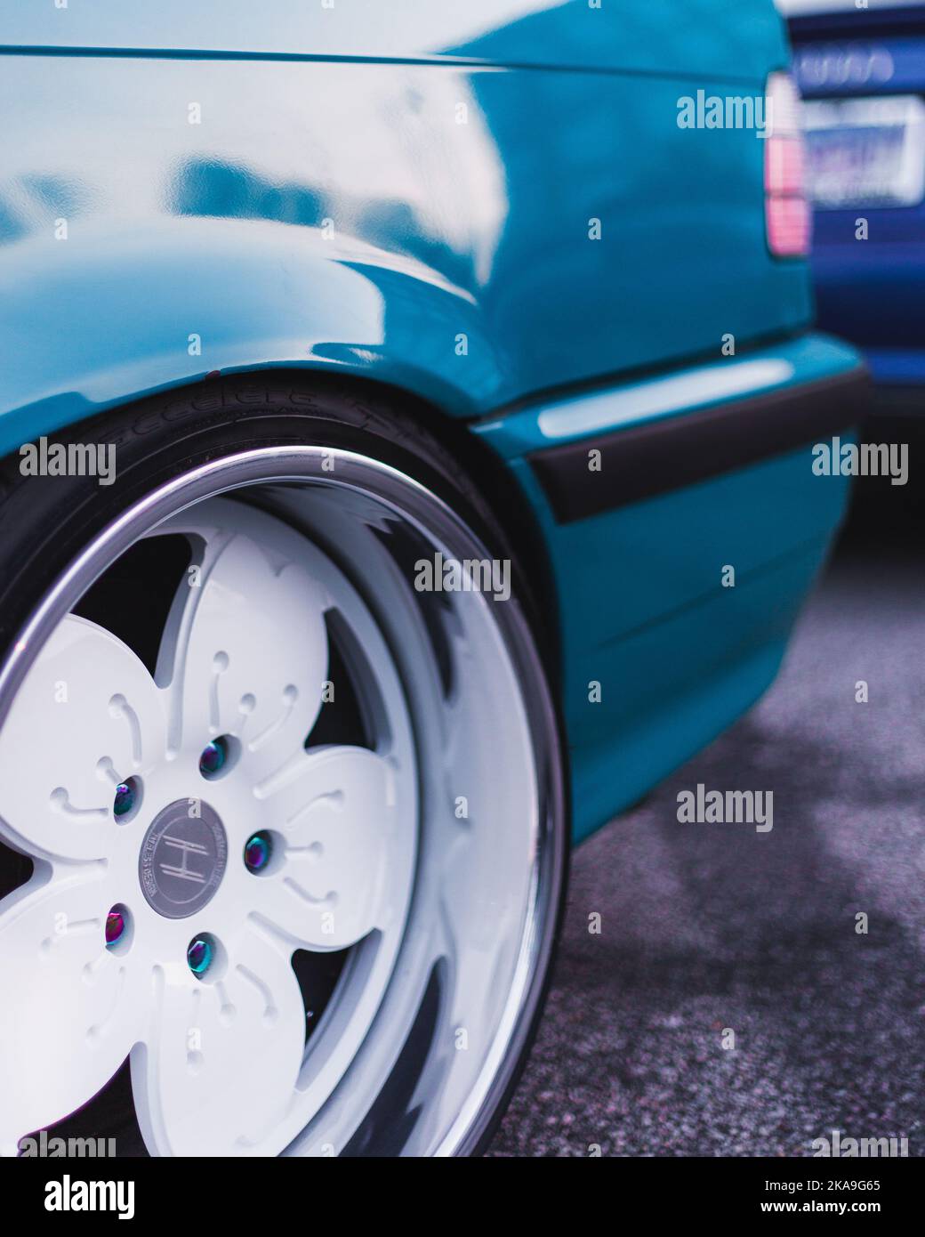 A closeup of a Laguna Blue BMW E36 M3 Convertible wheel Stock Photo - Alamy