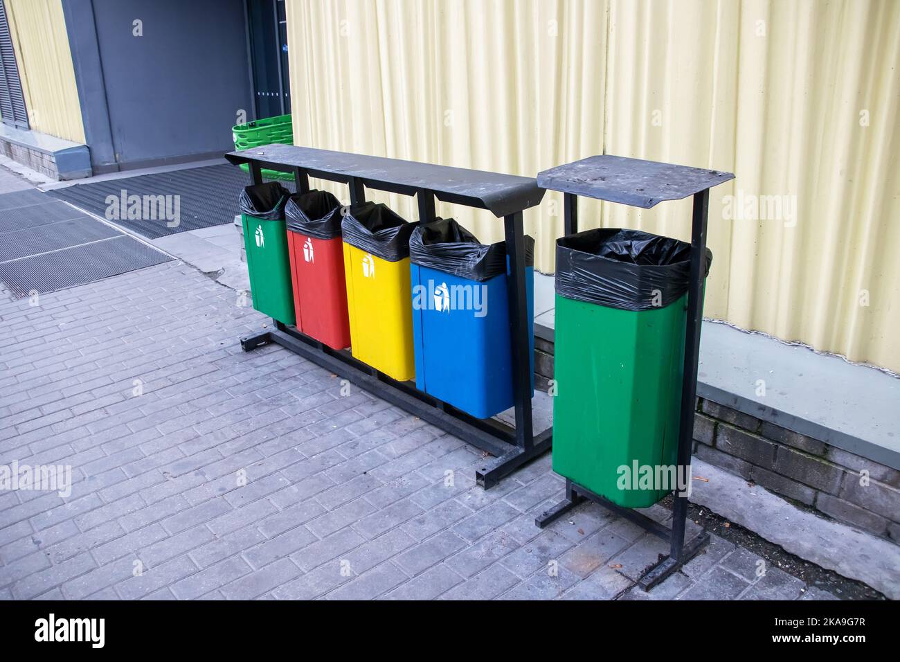 Colored bins for separate garbage collection close up Stock Photo - Alamy