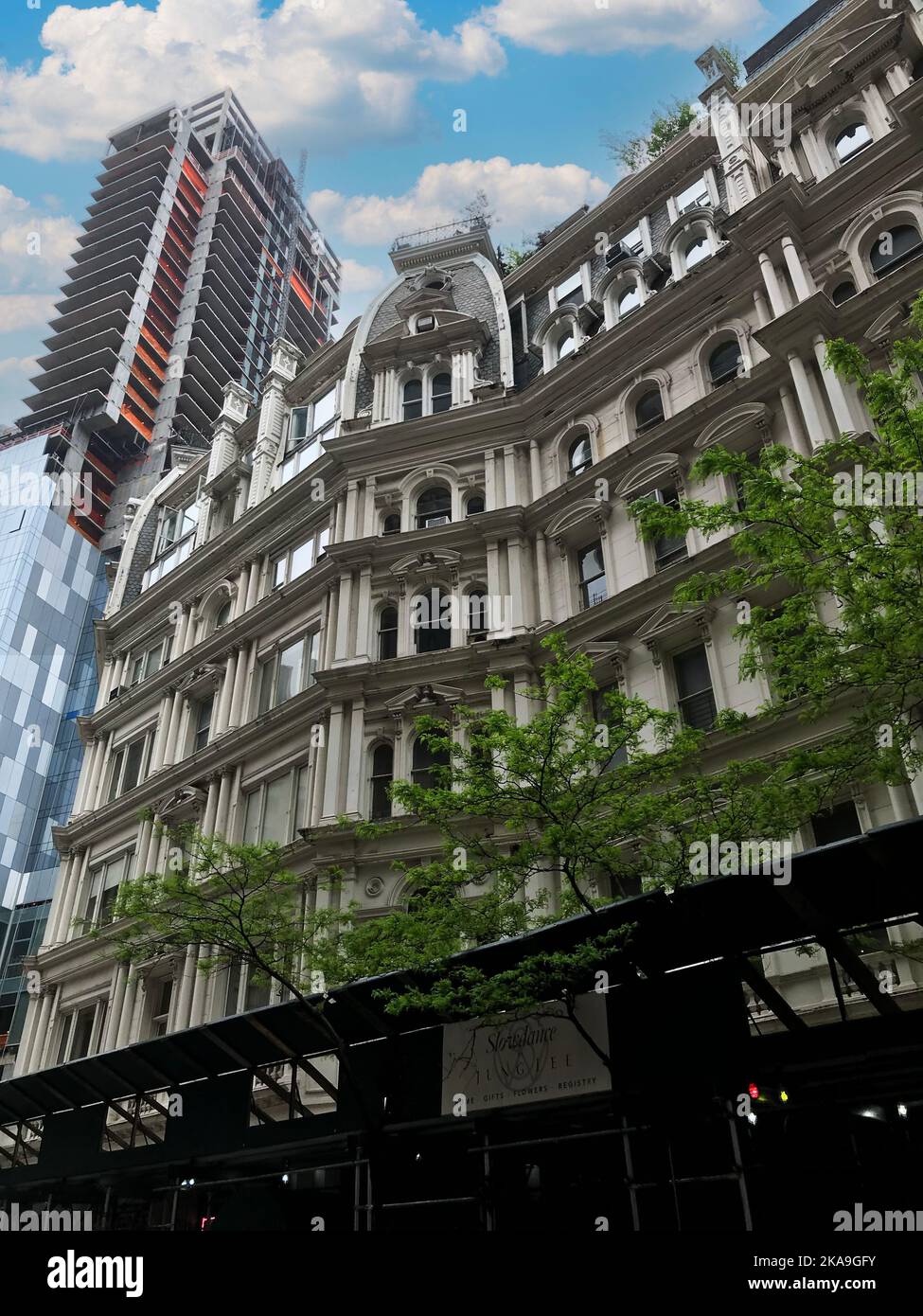A low angle shot of old and modern buildings in New York, USA against ...