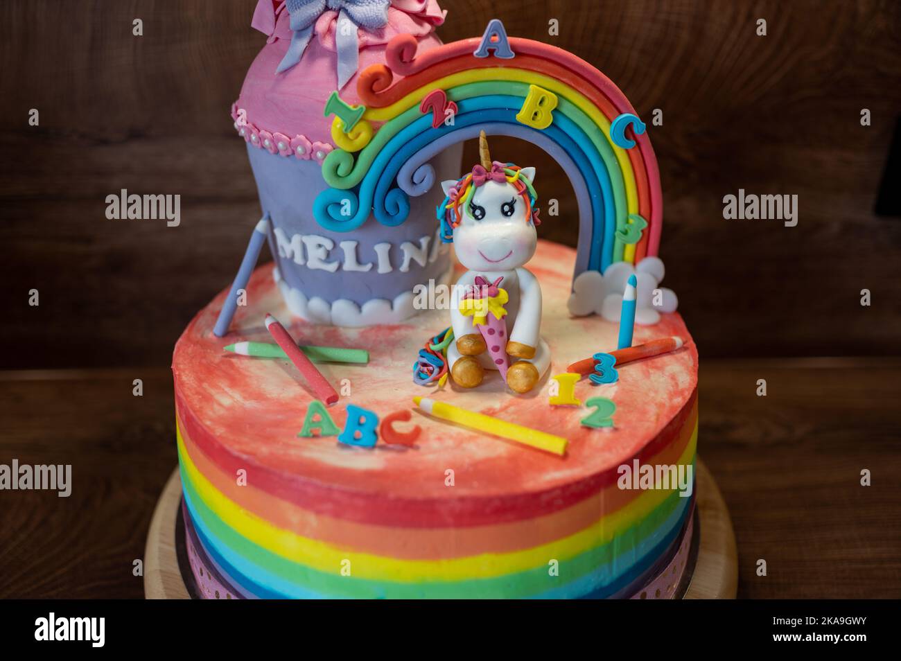A closeup shot of a colorful rainbow unicorn back-to-school cake Stock ...