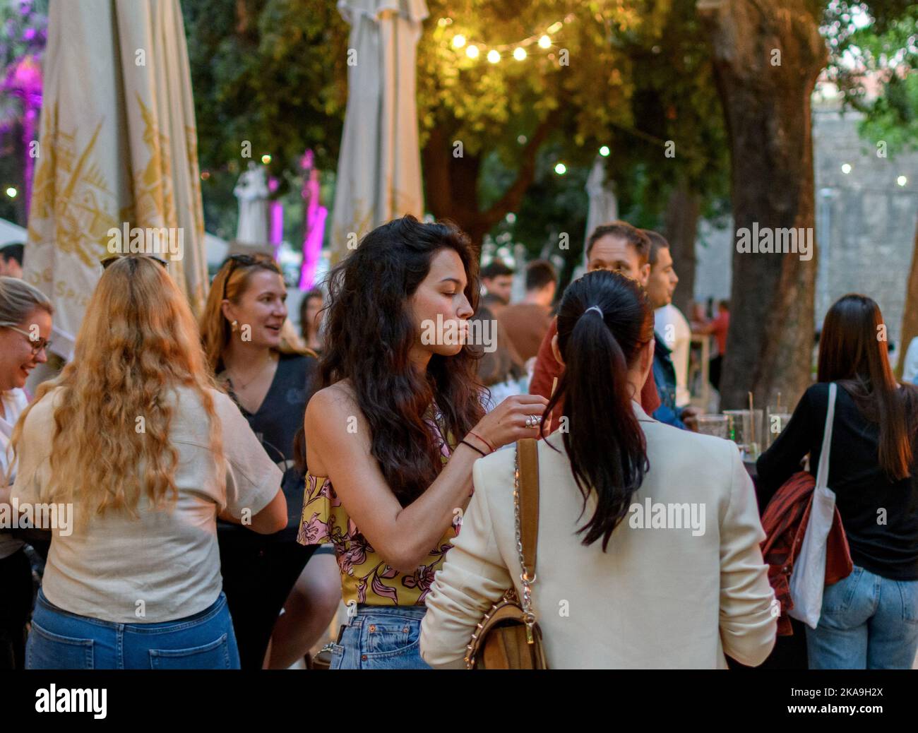 A view of crowds of people at a street food festival in park in Split ...