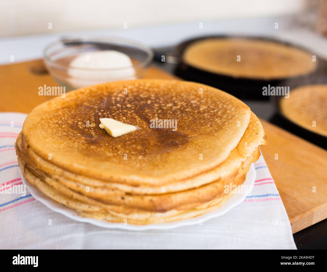 cooking traditional pancakes from wheat flour in the kitchen Stock ...