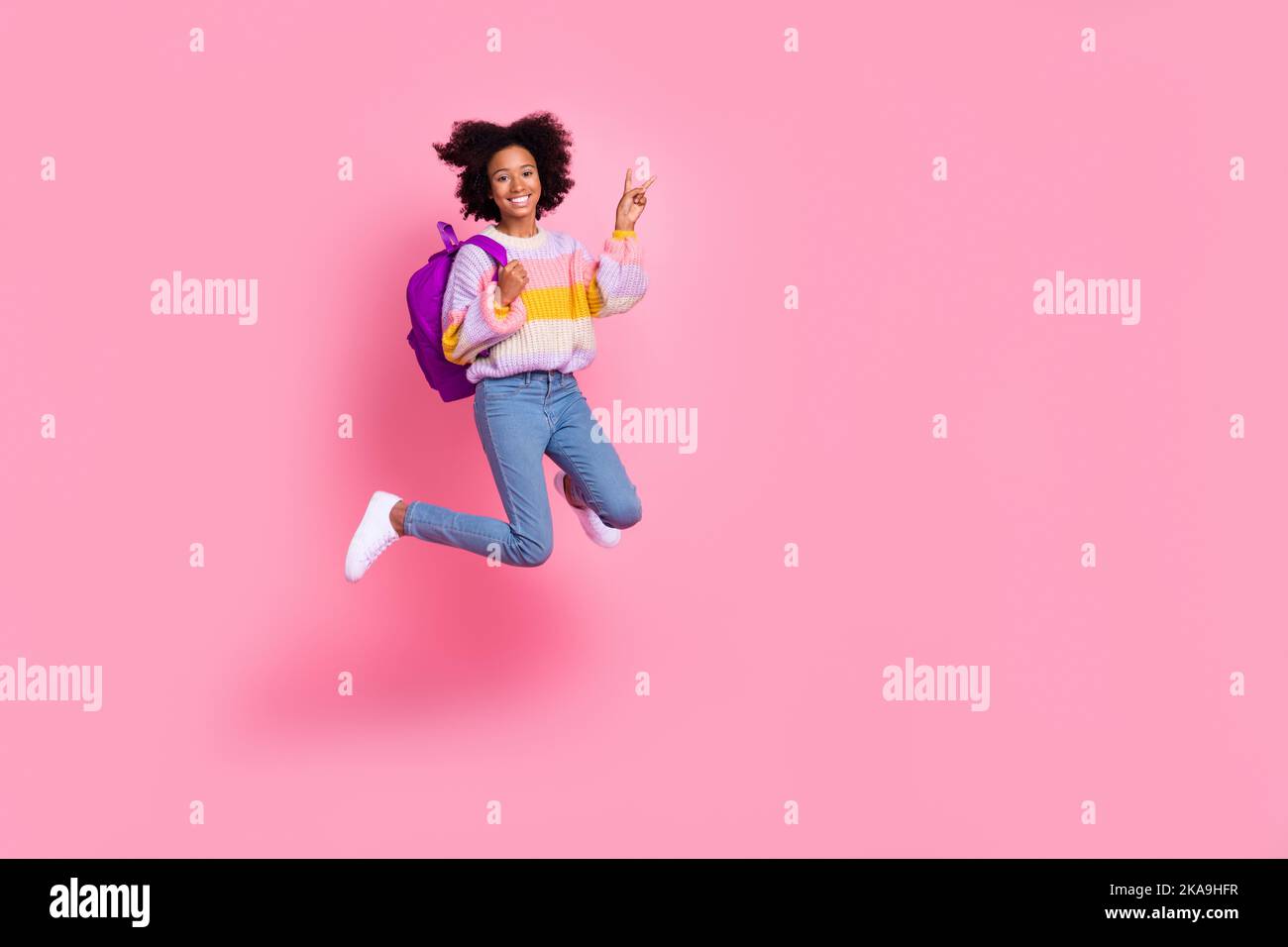 Full length photo of pretty shiny small kid wear striped sweater ...