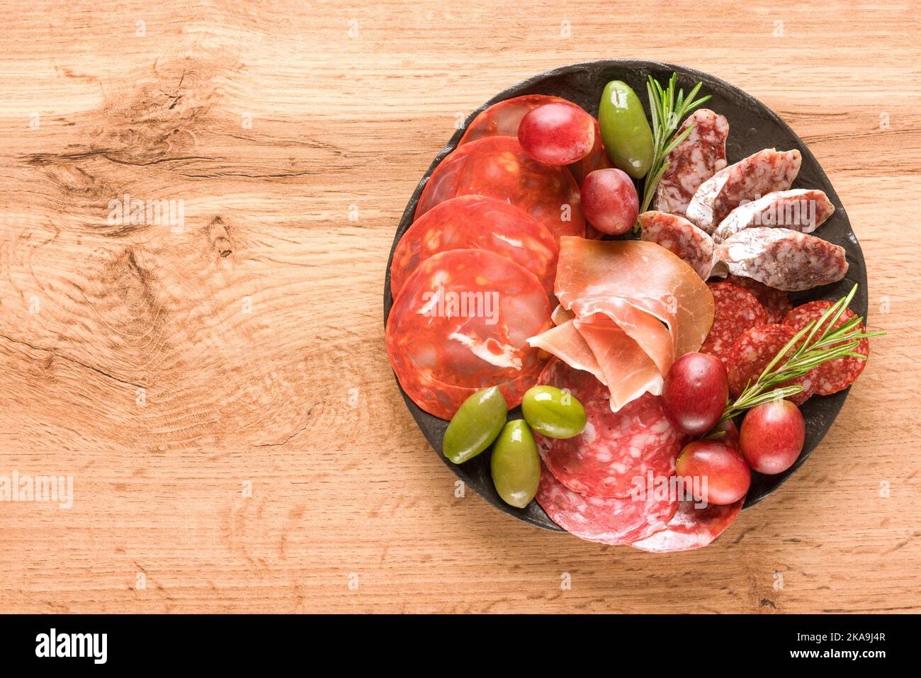 Traditional Italian antipasti. Charcuterie board with different types ...