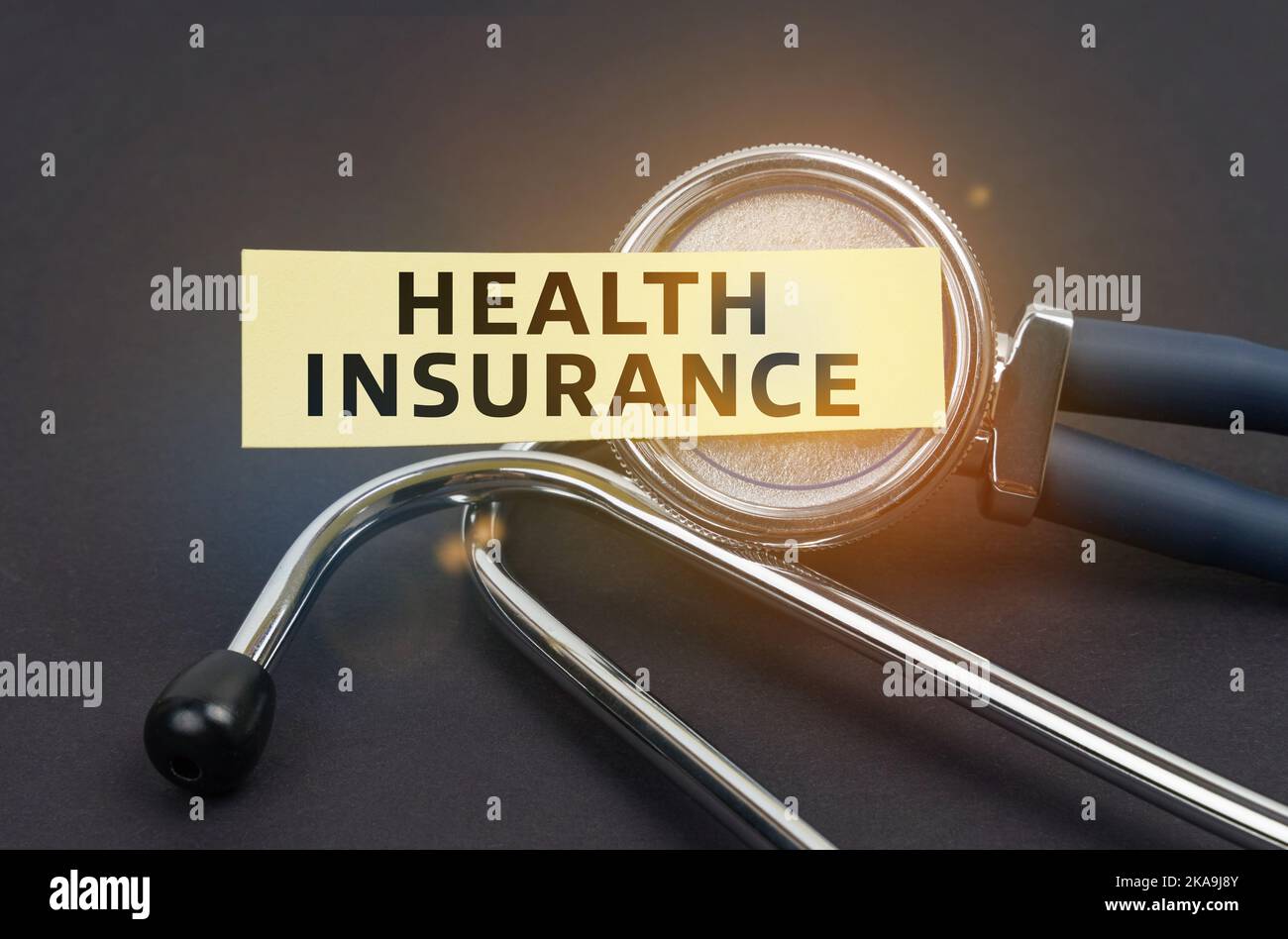 Medicine concept. On a black background, a stethoscope, on which a ...