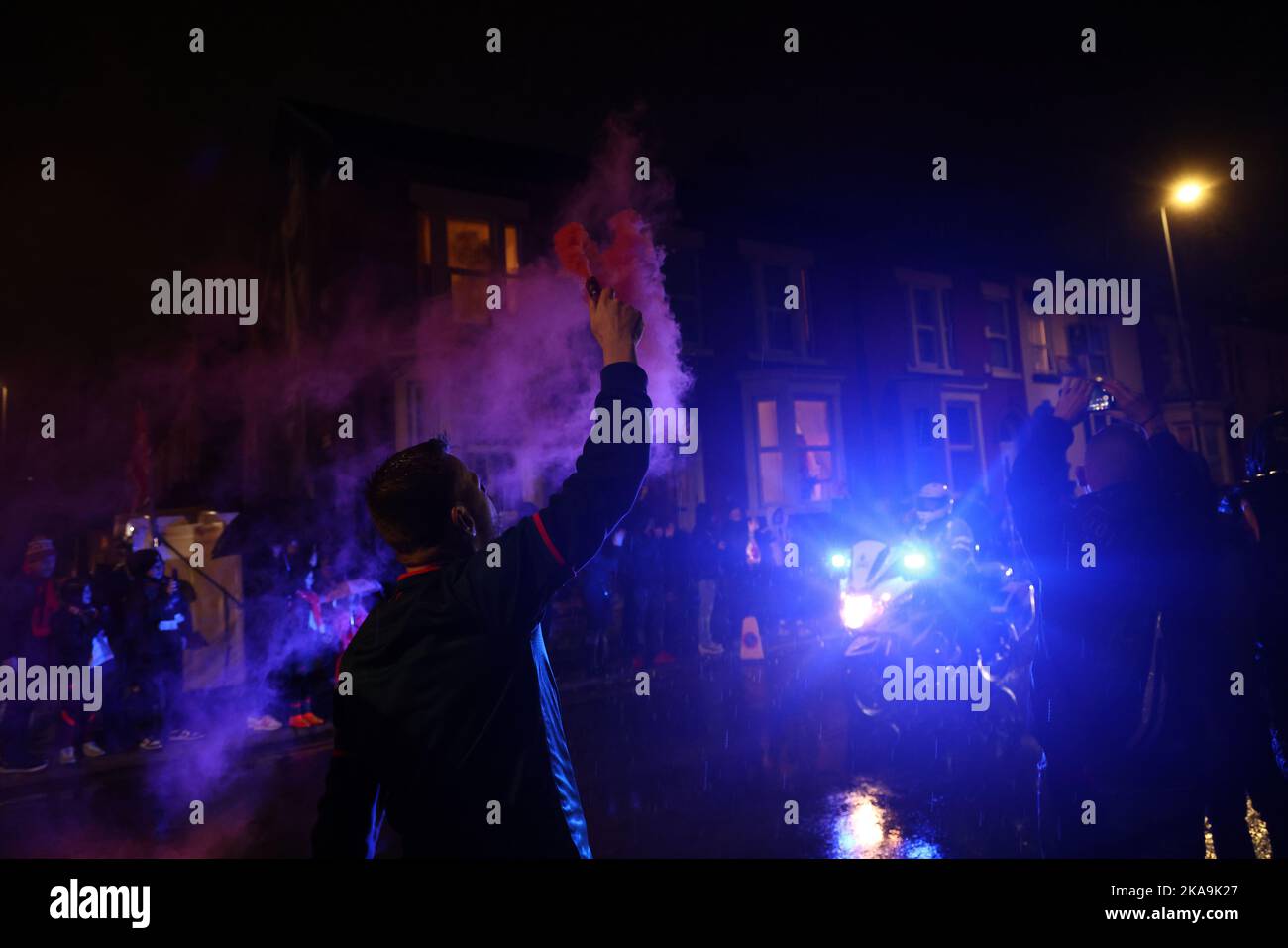 Liverpool, England, 1st November 2022. A fan holds a flare as the team ...