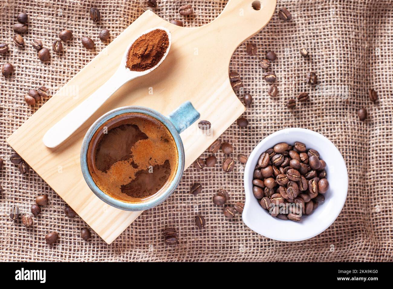 A top view of Americano and coffee beans on a wooden board Stock Photo ...
