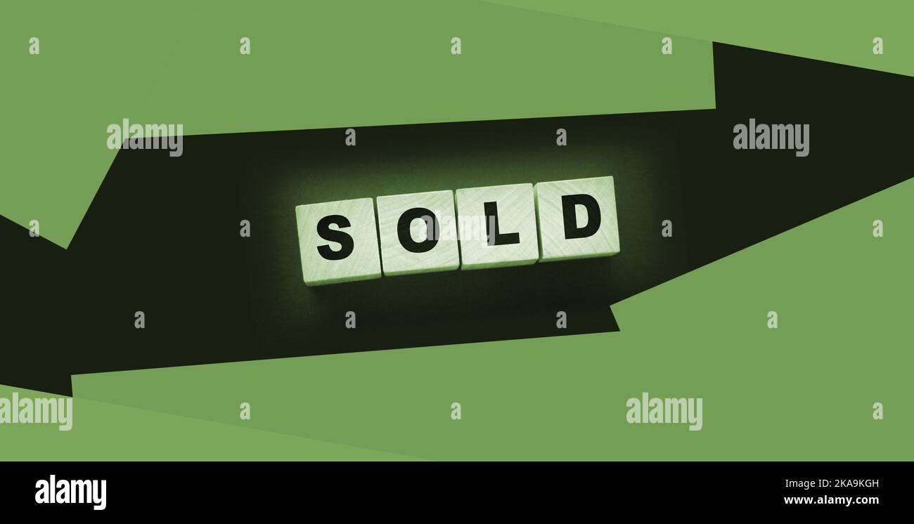 Sold Word Written In Wooden Cubes on black background. Real estate ...