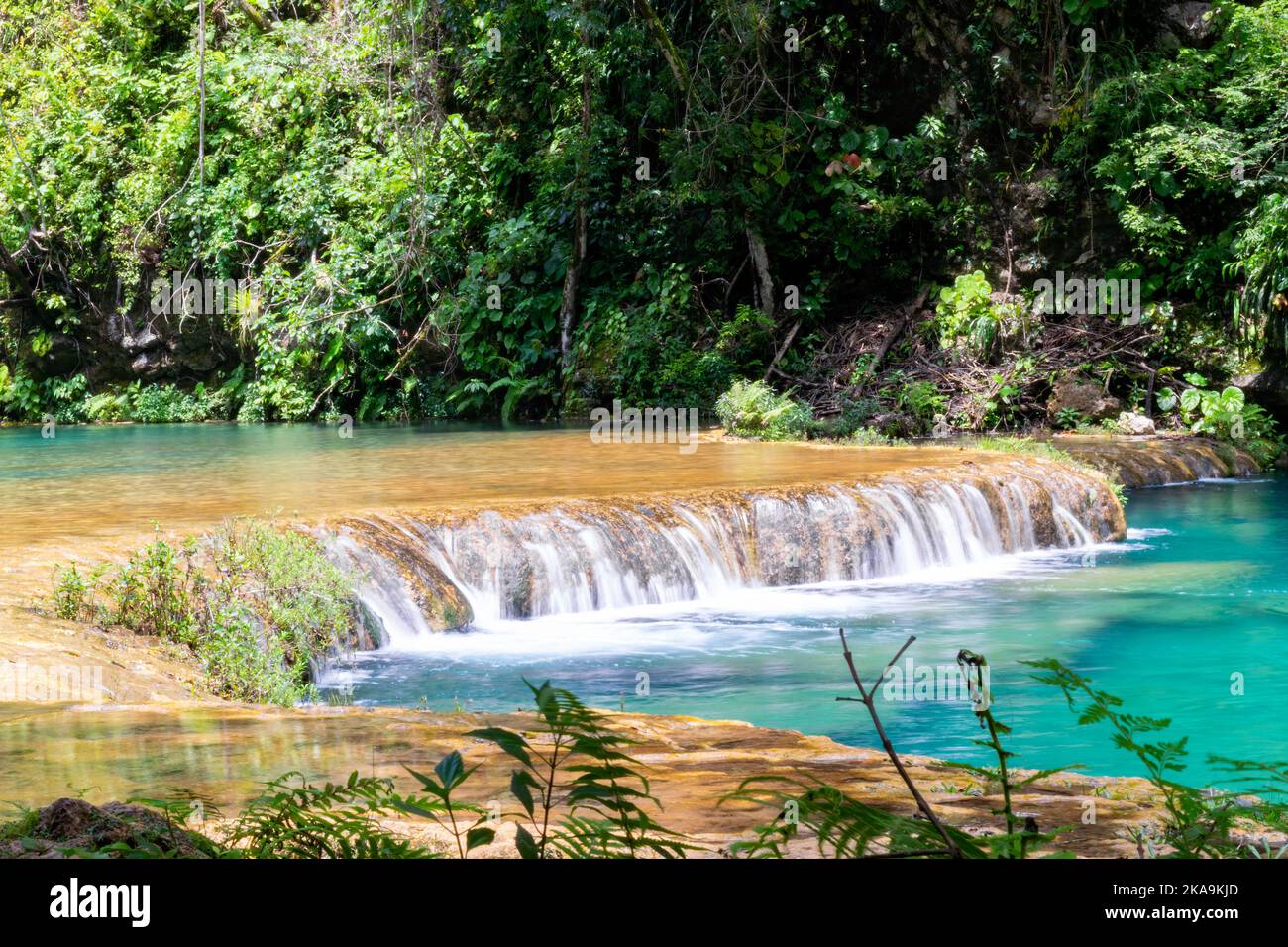 A large river and Semuc Champey natural monument in Guatemala, vertical ...