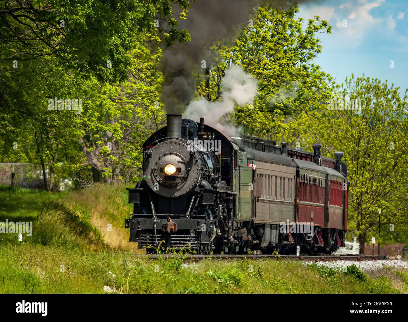View of an Antique Restored Steam Passenger Train Approaching Along a ...
