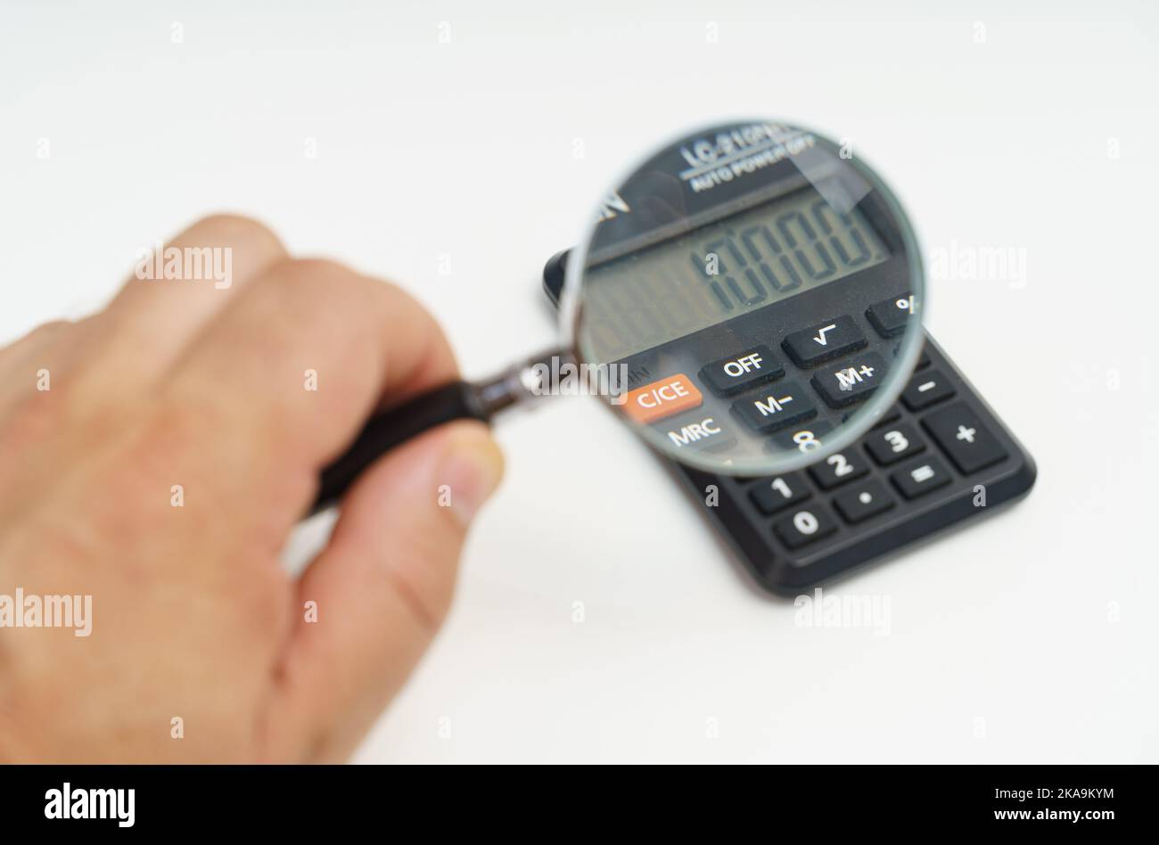 Business and finance concept. The magnifying glass looks at the ...