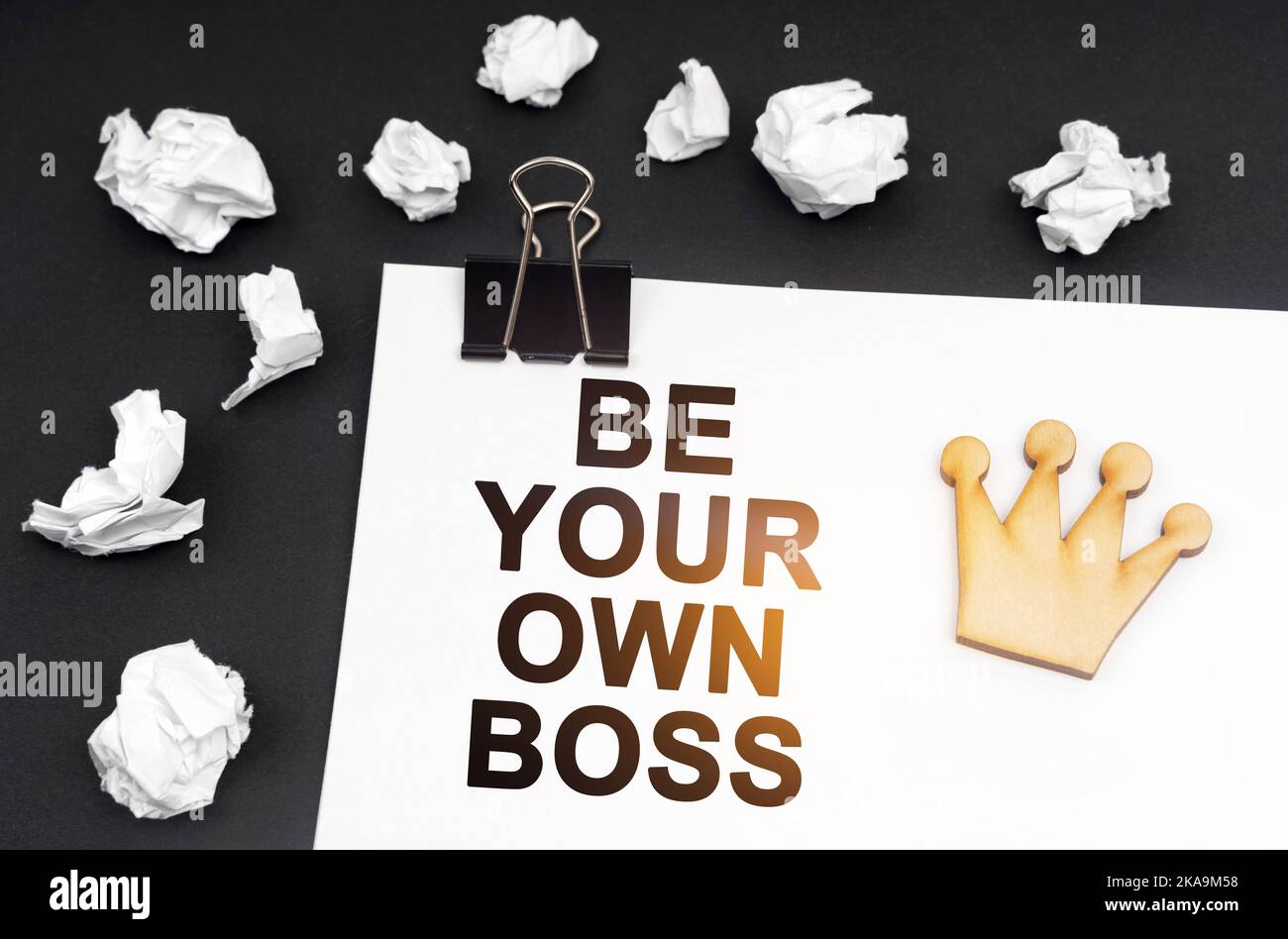 Business and finance concept. On a black background, crumpled paper and ...