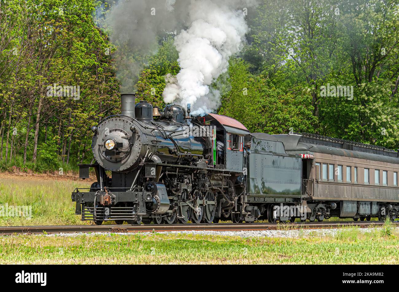 View of an Antique Restored Steam Passenger Train Approaching Along a ...