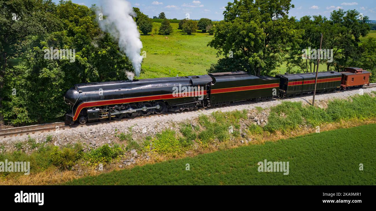 Drone View of an Antique Steam Engine, Blowing Steam and Traveling ...