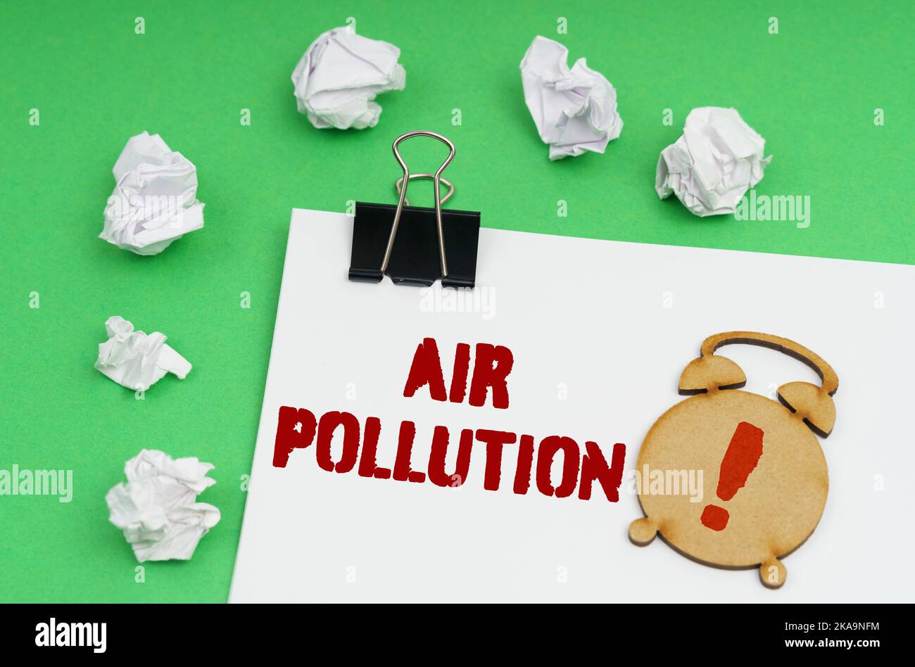 Environmental concept. On a green background there is a white sheet, on ...