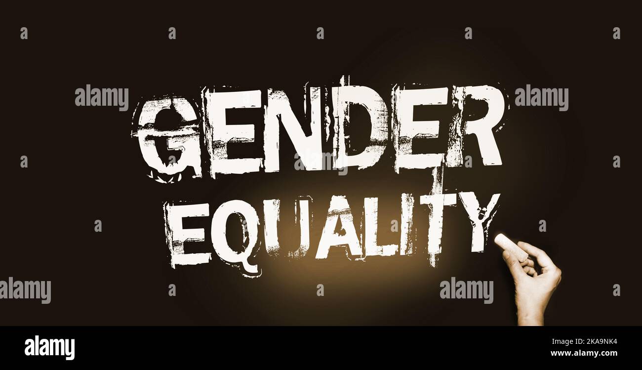 Gender Equality on blackboard and hand with chalk. Equal pay and equal ...