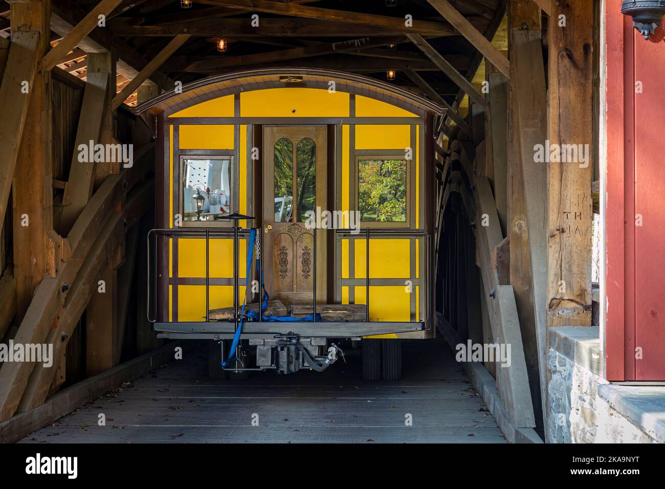Installing a New Yellow Passenger Antique Coach Thru a Cover Bridge on ...