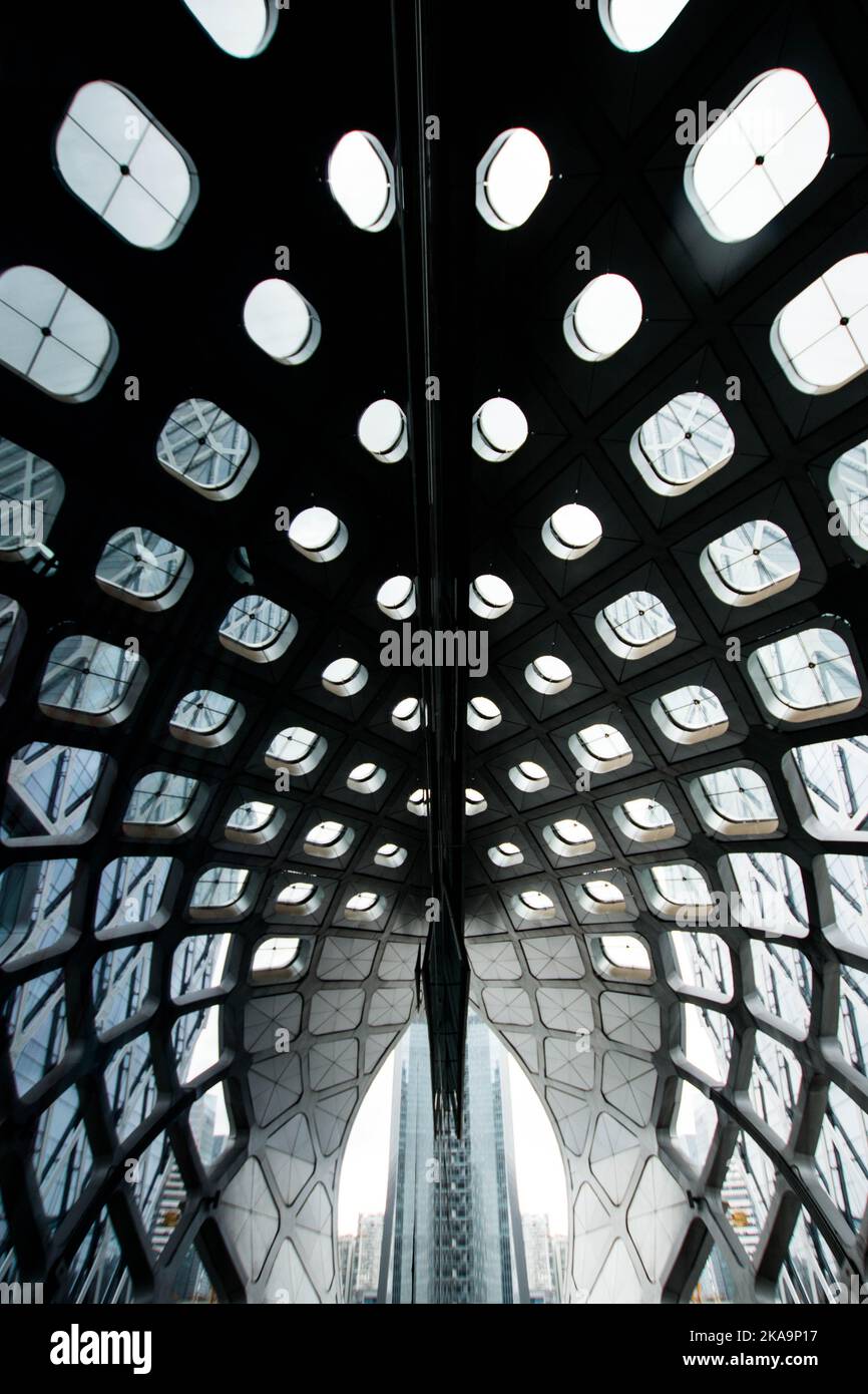 A vertical shot of an abstract symmetrical interior wall of Shenzhen ...