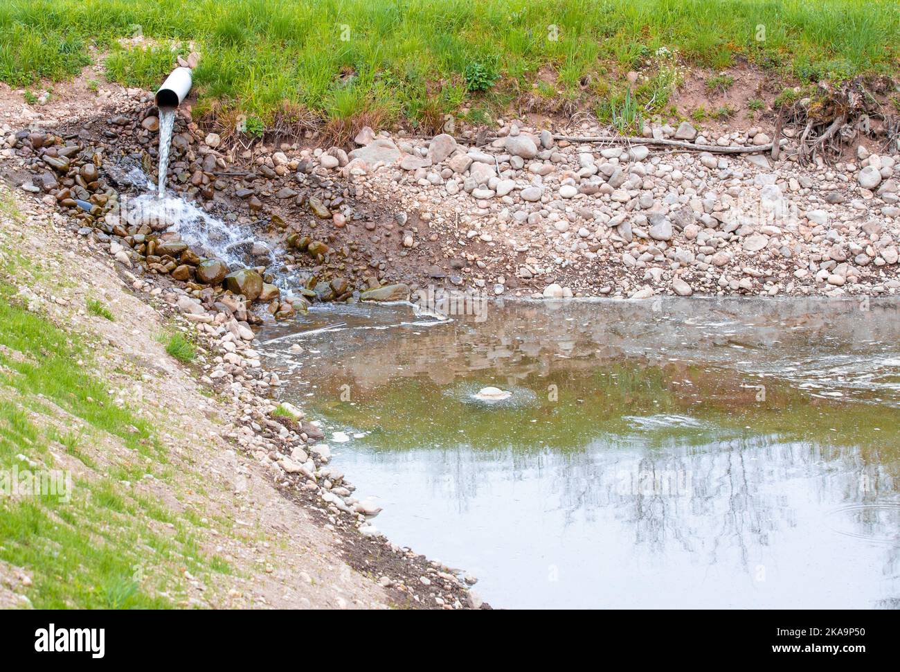 Discharge of polluted water through a pipe, toxic, flow, waste water ...