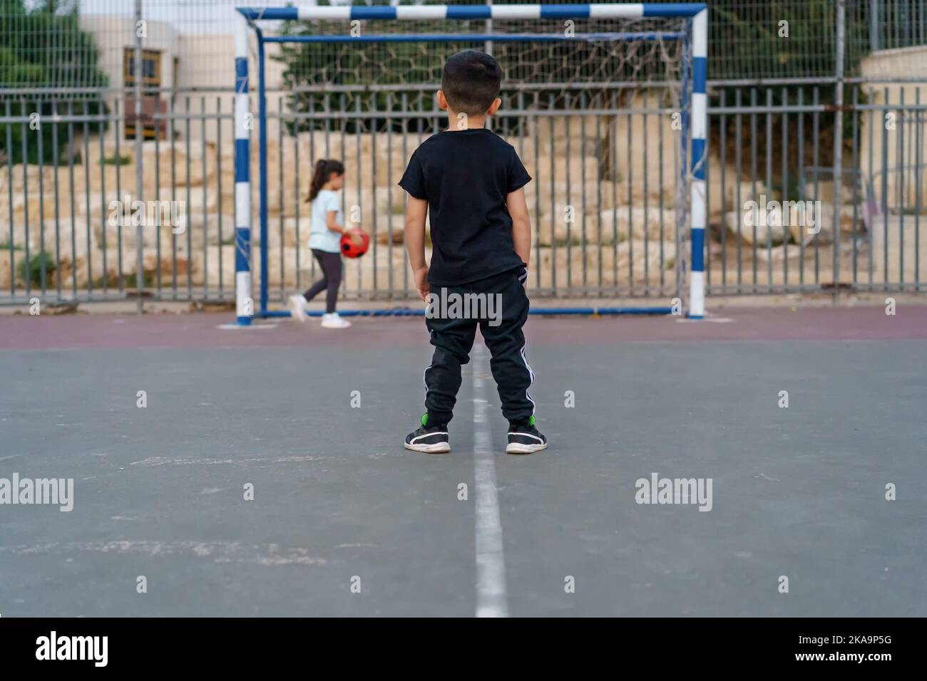 Kids playing football black and white hi-res stock photography and ...