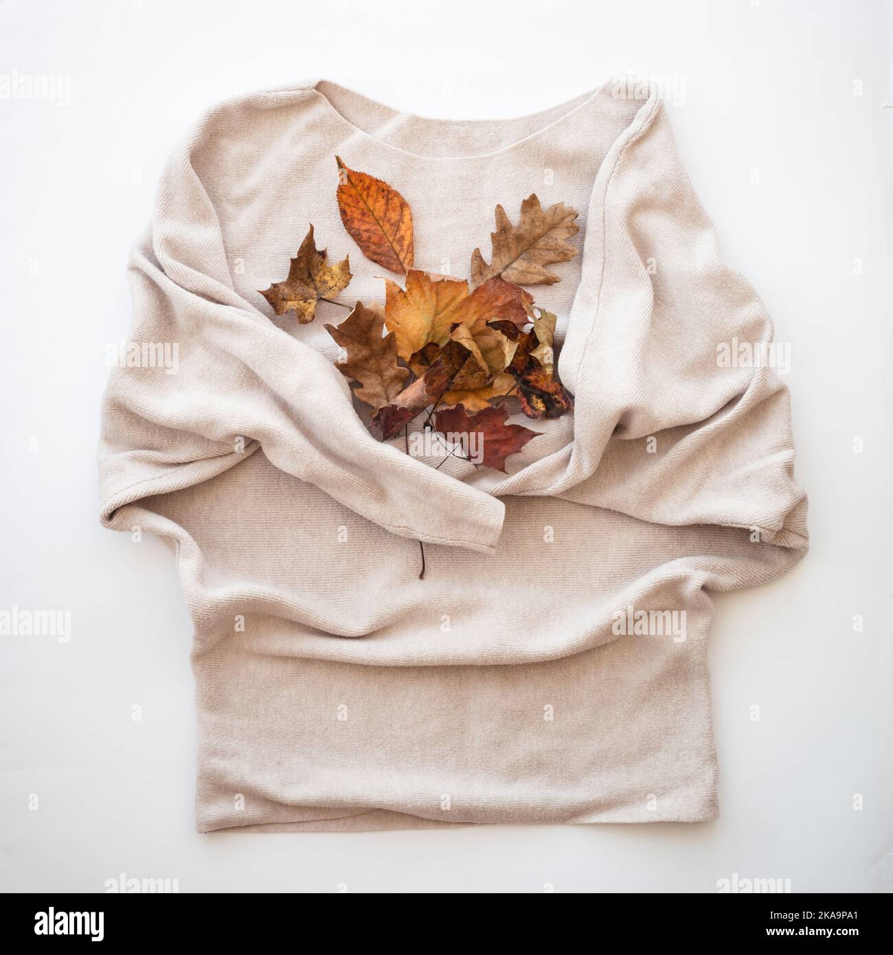 Autumn flat lay background with sweater and fall leaves Stock Photo - Alamy