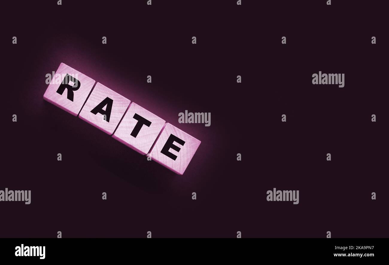 Rate word concept on wooden cubes on black . Business services rating ...