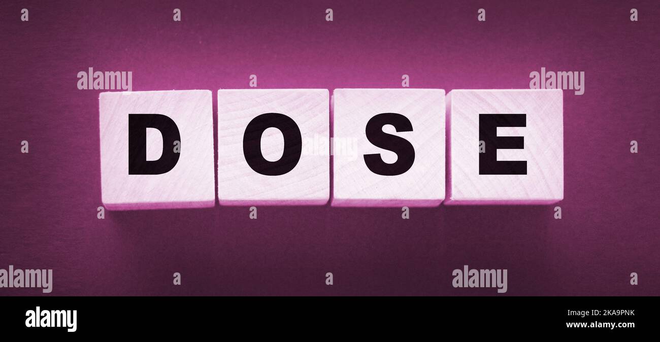Wooden blocks with the word Dose. Medical concept Stock Photo - Alamy