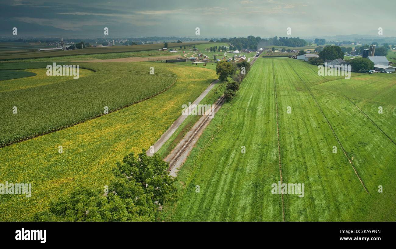 Drone View of Amish Countryside With Barns and Silos and a Single ...