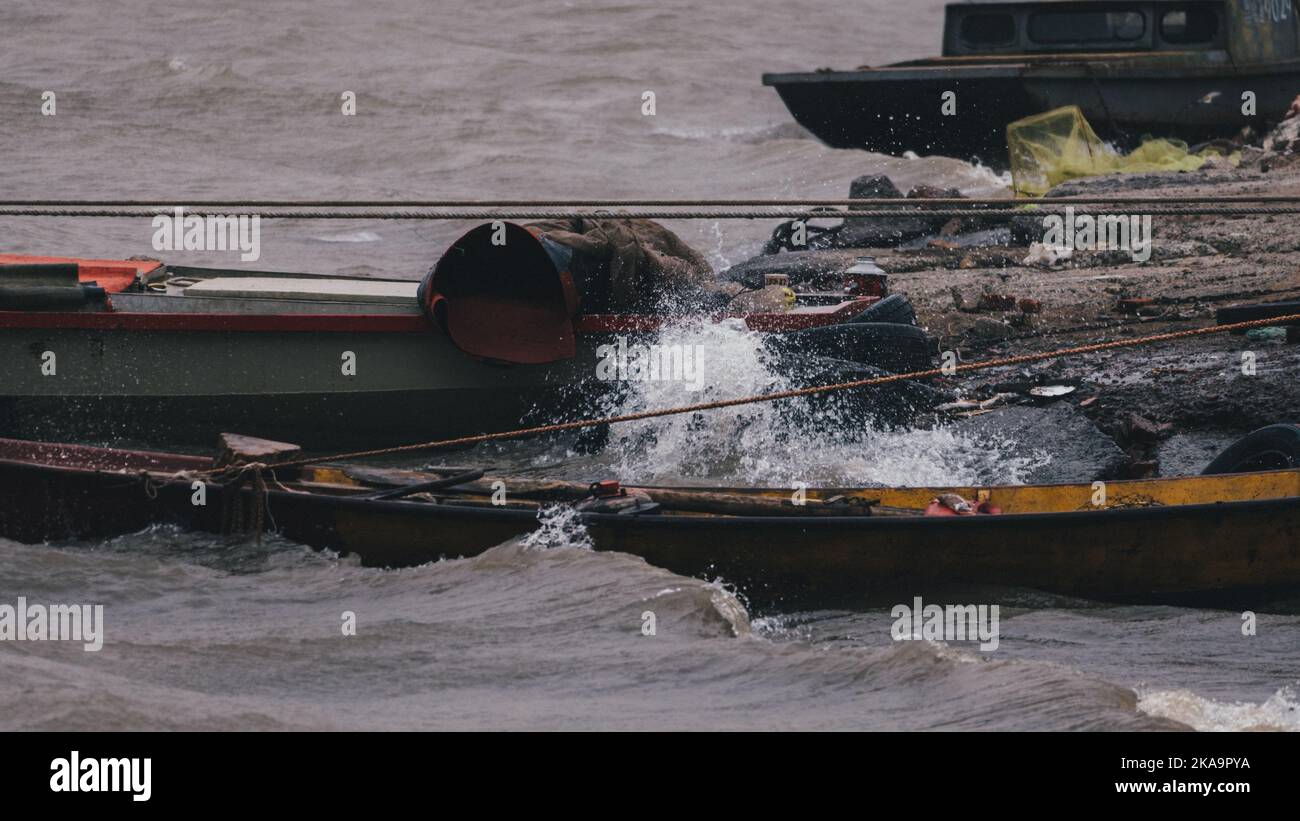 The waves crashing into the ship making foam on a windy day Stock Photo ...