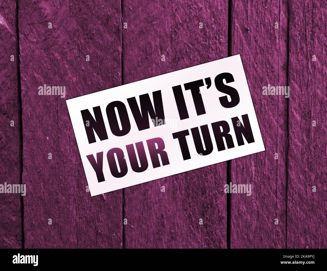 words NOW ITS YOUR TURN in black letters on business card put on wooden ...