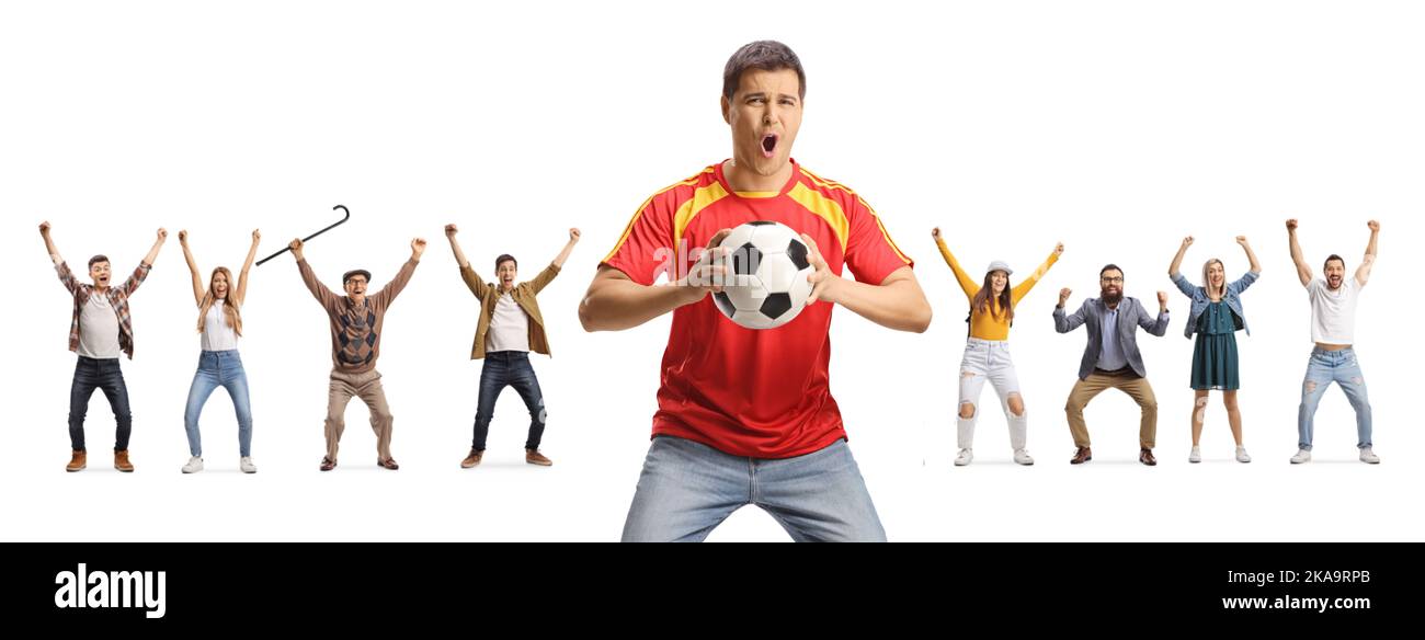 Excited football fan holding a ball and cheering with other people in ...