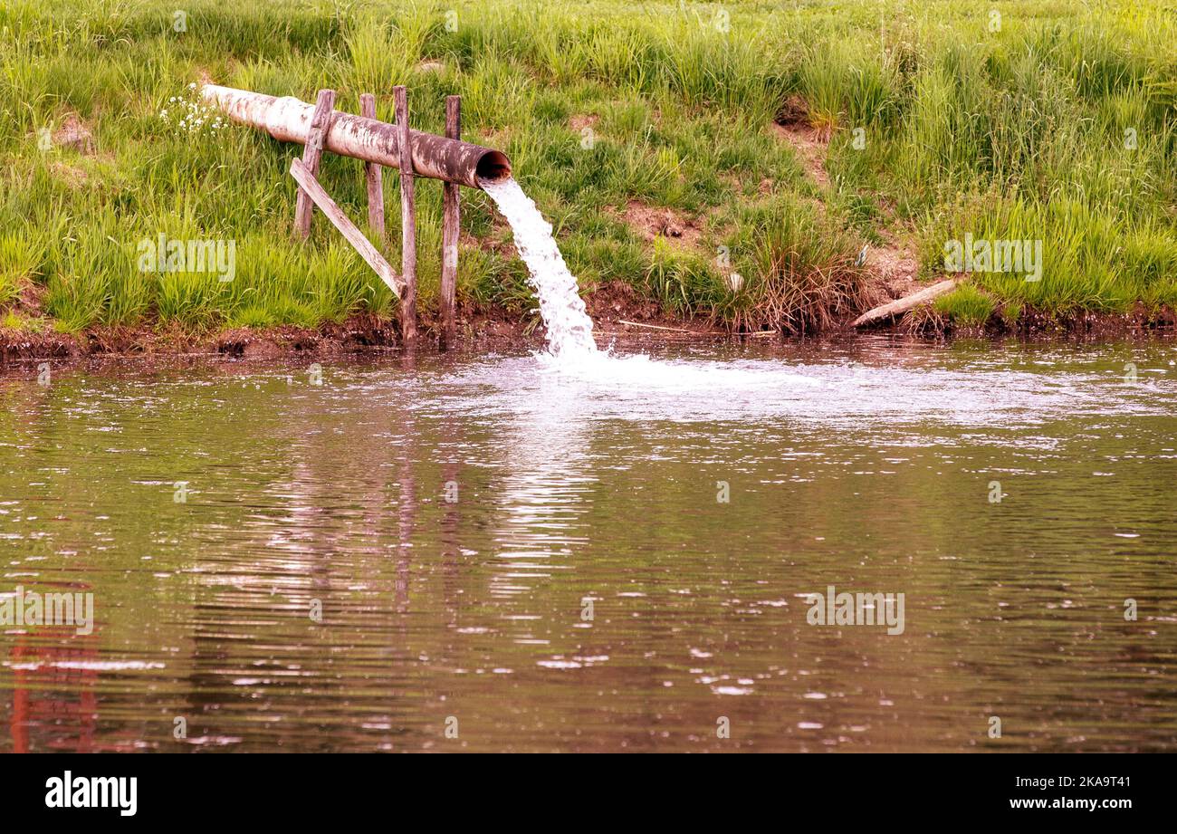 Discharge of polluted water through a pipe, toxic, flow, waste water ...