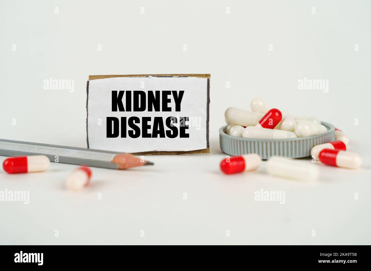 Medical concept. On a white background, medical capsules, a pencil and ...