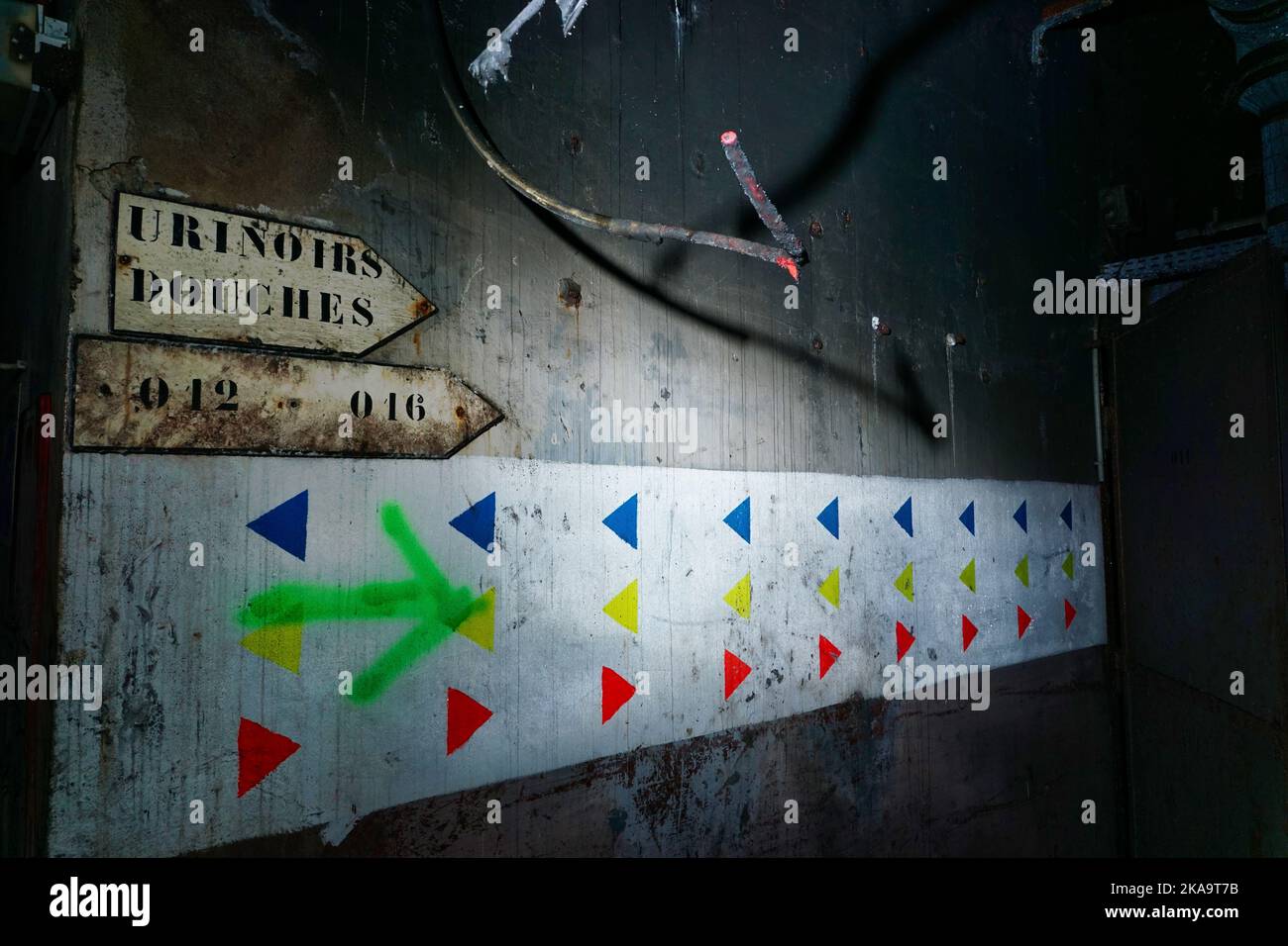 An old wall with signs showing direction with colorful arrows Stock ...